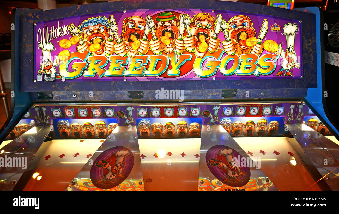Greedy gobs two pence slot machine in amusement arcade Stock Photo - Alamy