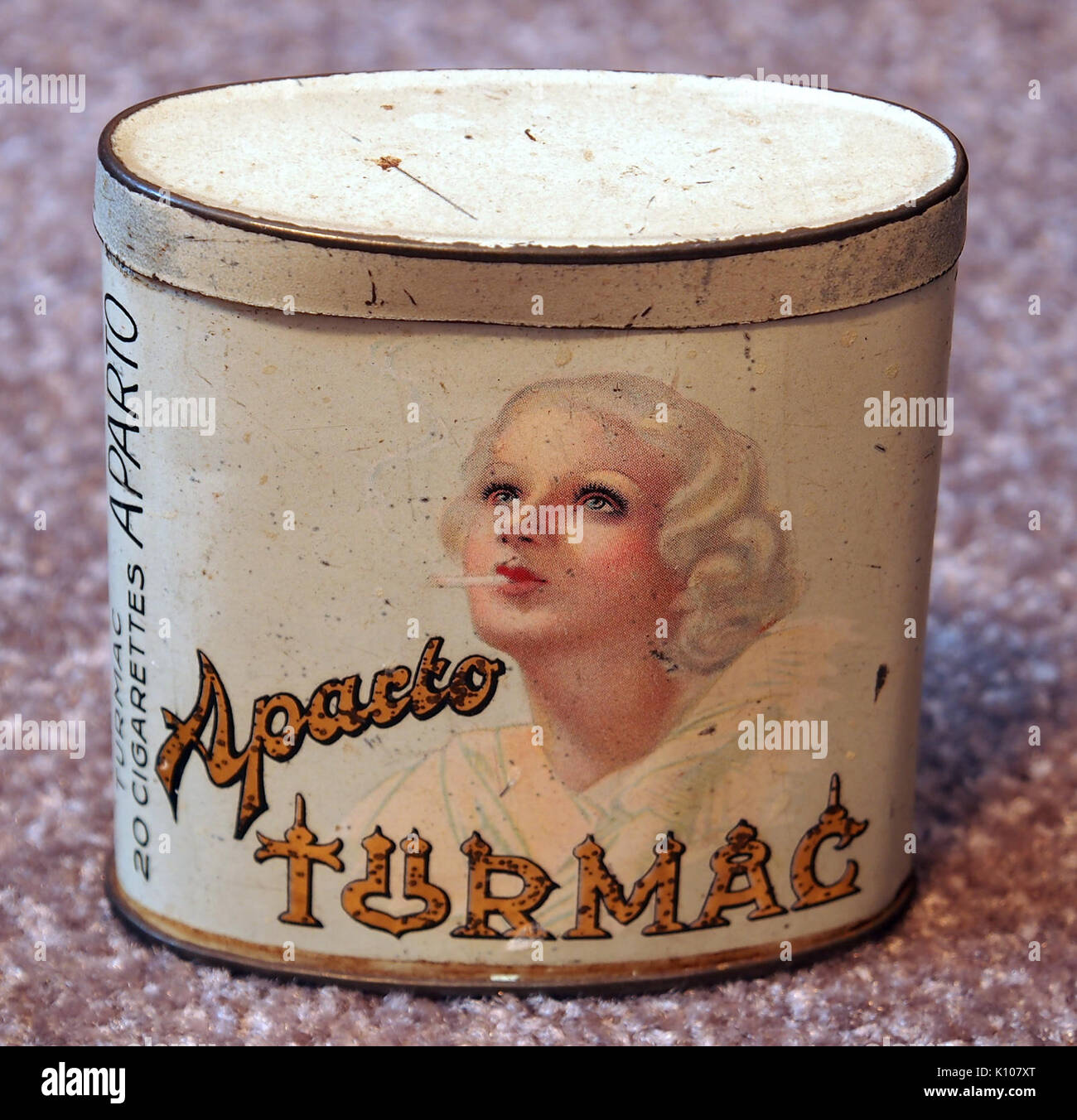 A vintage photograph showing an Aparto Turmac cigarette tin, reflecting ...