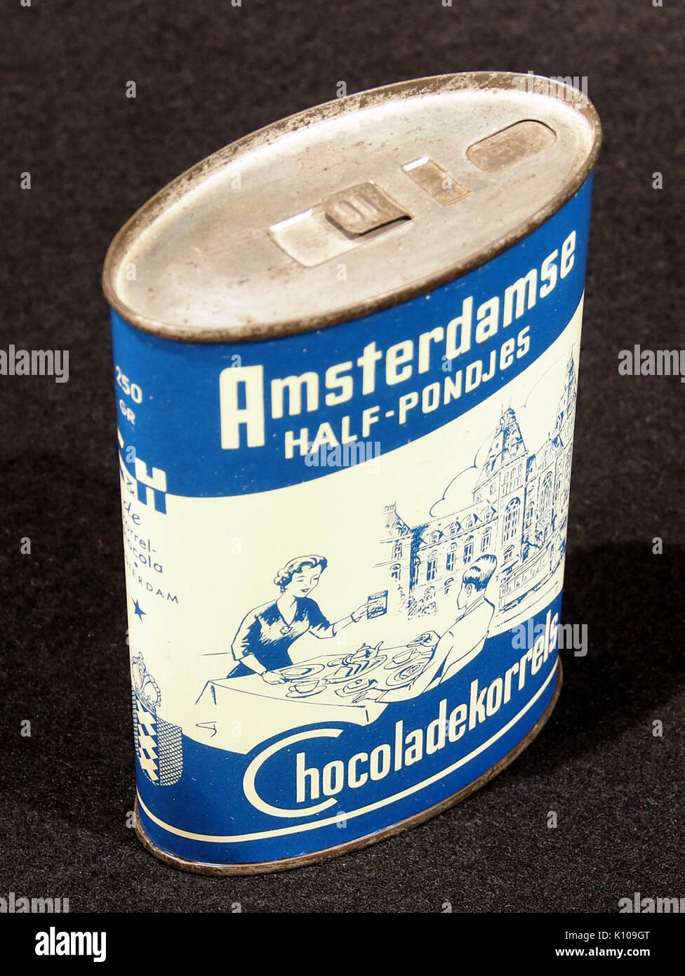 The image depicts a vintage tin container from Amsterdam featuring ...