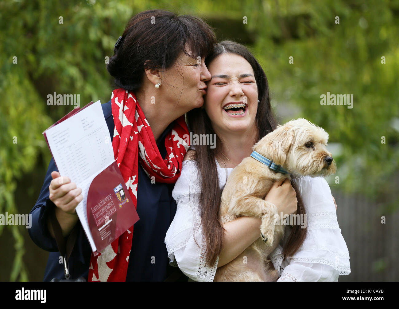 Sarah Hand who achieved 10 A*s celebrates with her mother Maria and dog ...