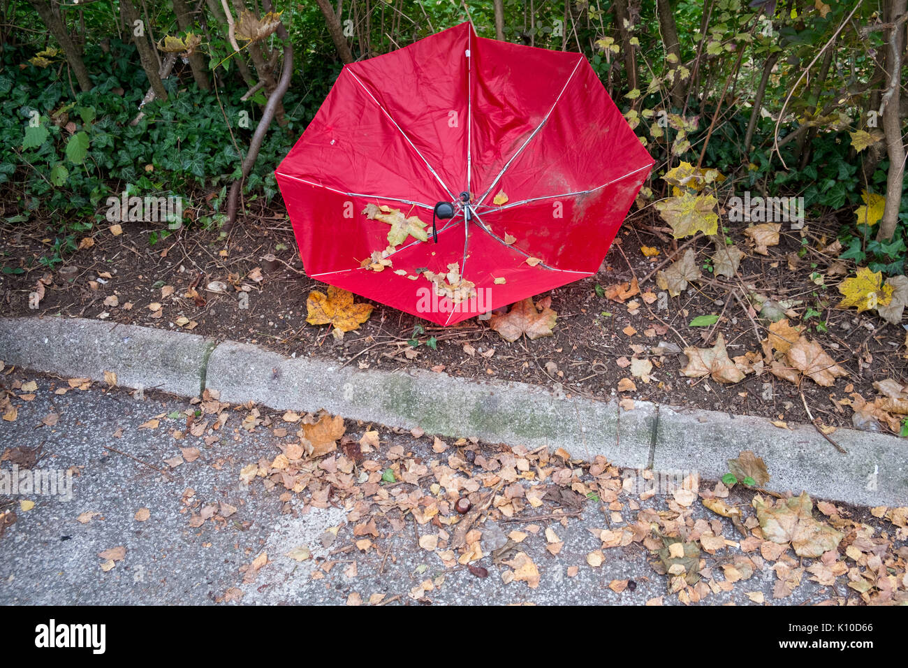 Broken umbrella red hi-res stock photography and images - Alamy