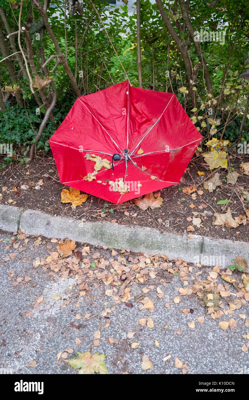 Broken umbrella red hi-res stock photography and images - Alamy