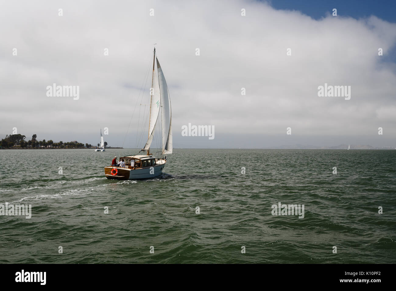 Custom built wooden sailboat sails the bay Stock Photo - Alamy