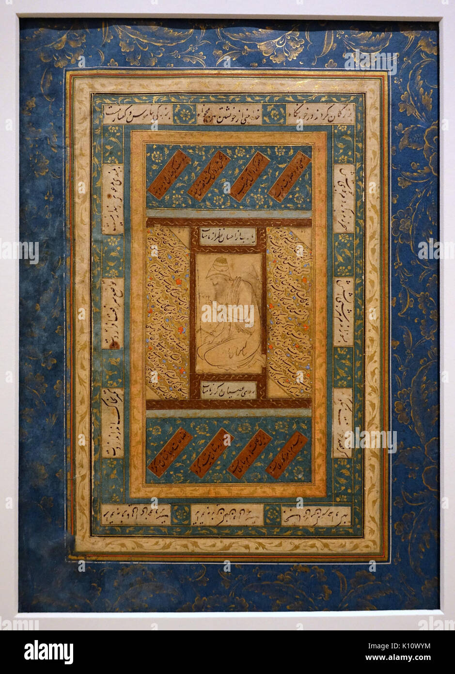 Album leaf (muraqqa') of nasta'liq calligraphy with drawing of seated ...