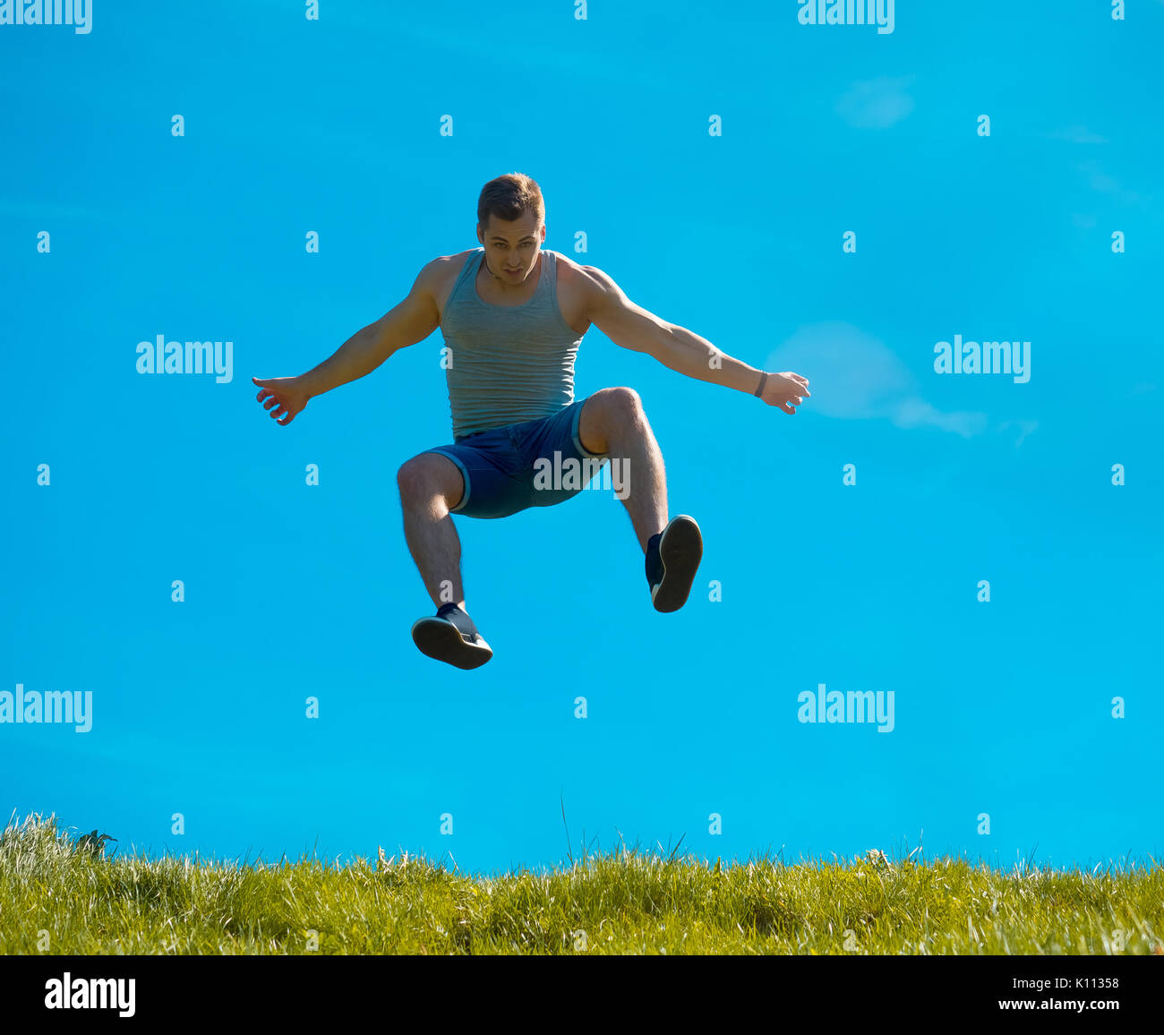 Model poses in grass hi-res stock photography and images - Alamy