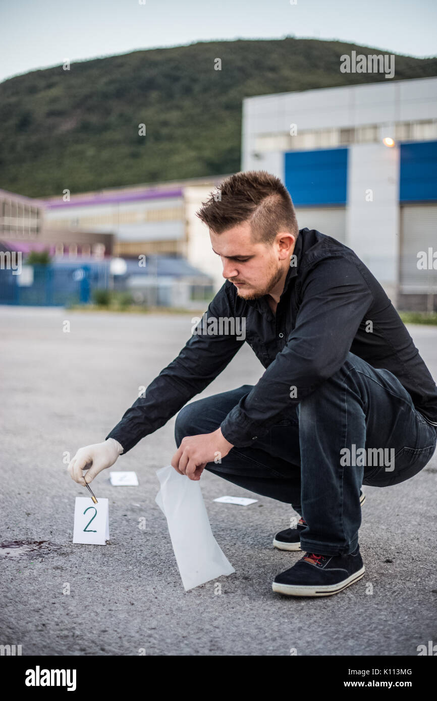 Crime scene, murder, investigation, bloody trail on asphalt ...