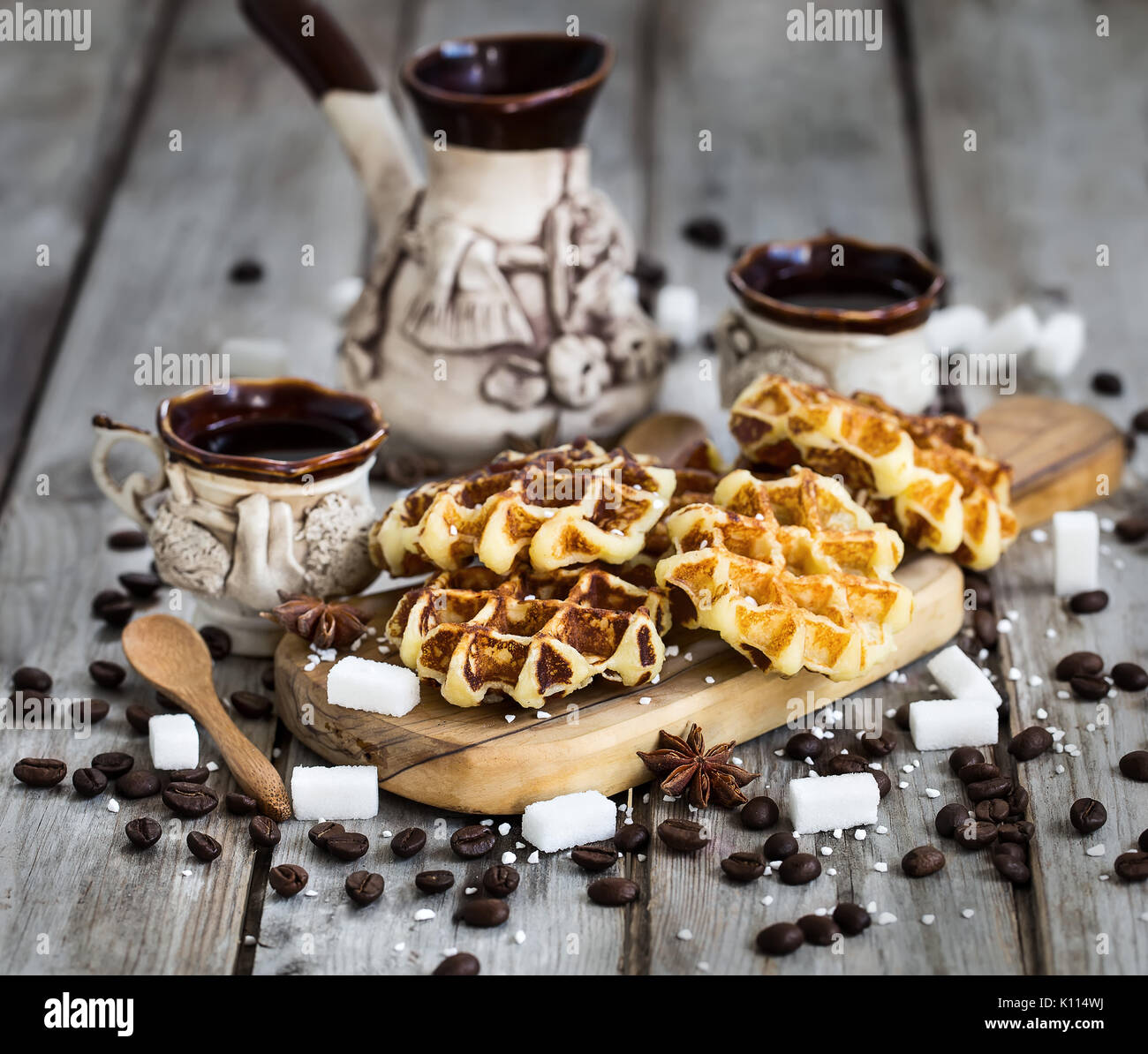 Homemade liege belgian waffers with sugar pearls and coffee on old ...
