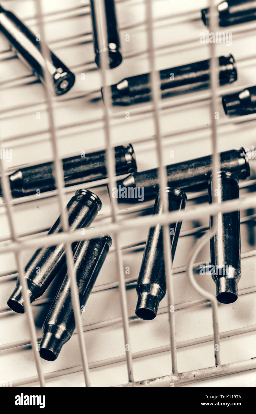 Bullets inside a cage, a concept on gun violence Stock Photo - Alamy