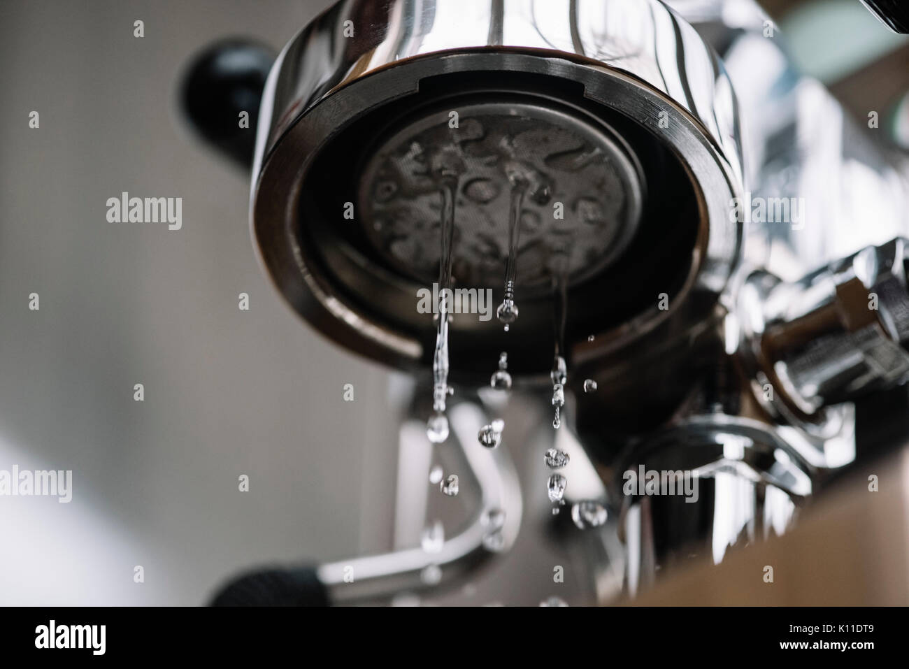 Maintenance of the espresso machine's group: basic water cleaning Stock ...