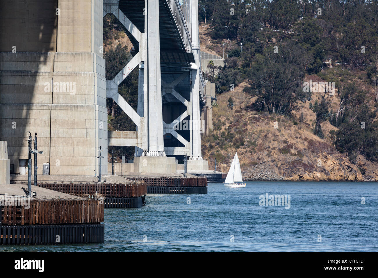 Sailboat and bridge footings Stock Photo - Alamy