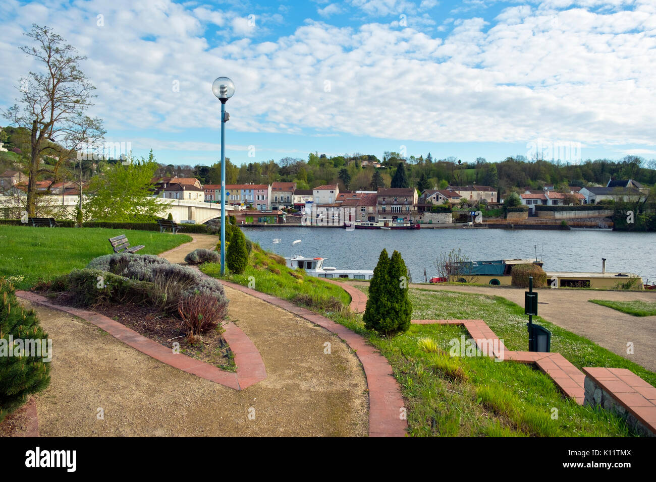 Small riverside park in spring sunshine by the River Lot in Saint ...