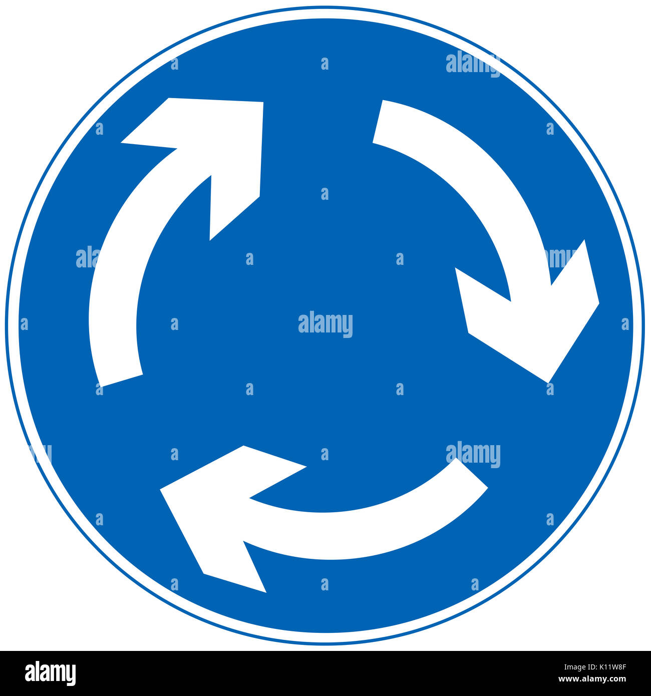 Mini roundabout road sign on white background Stock Photo - Alamy