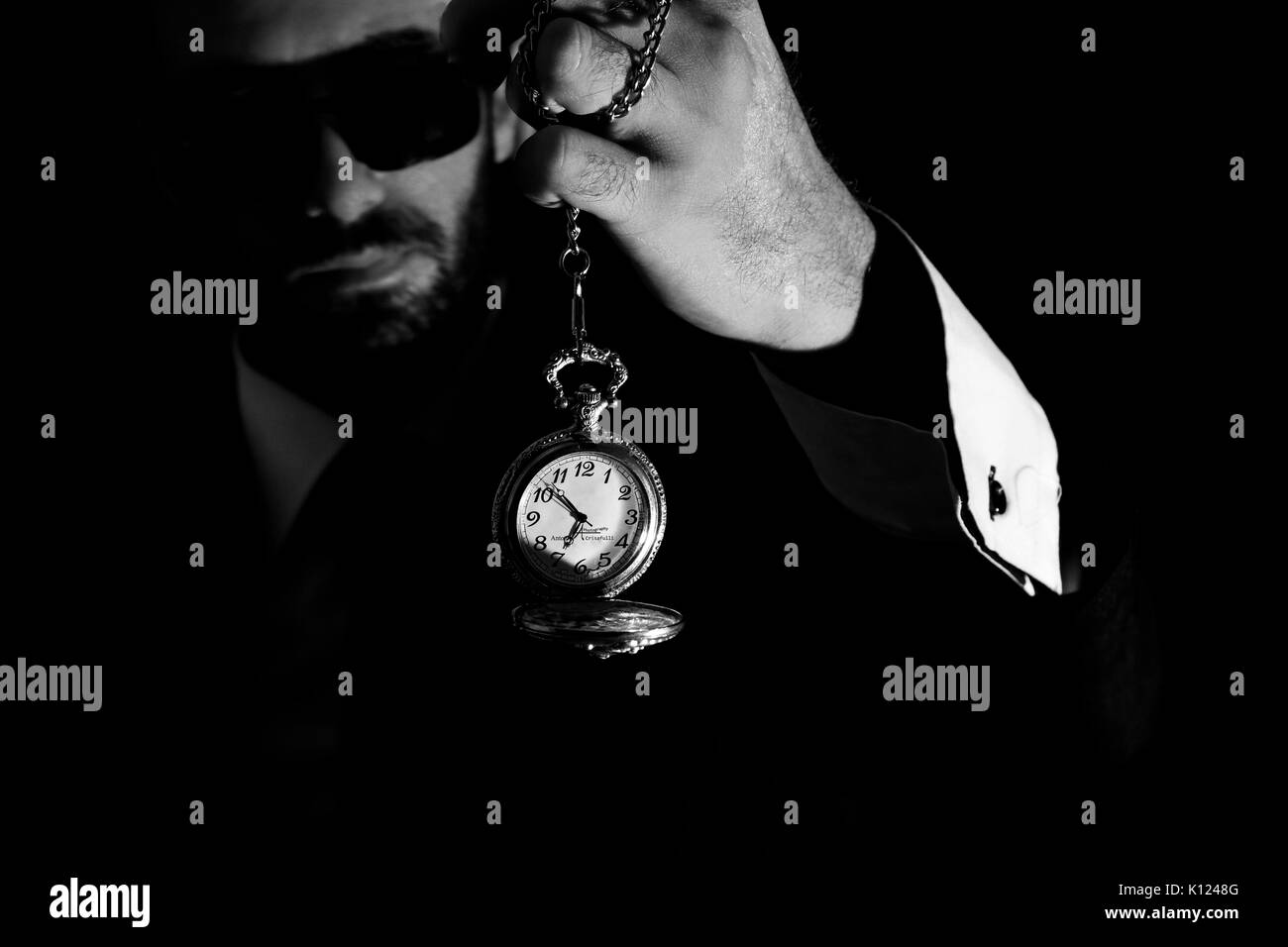 man holding pocket watch Stock Photo - Alamy