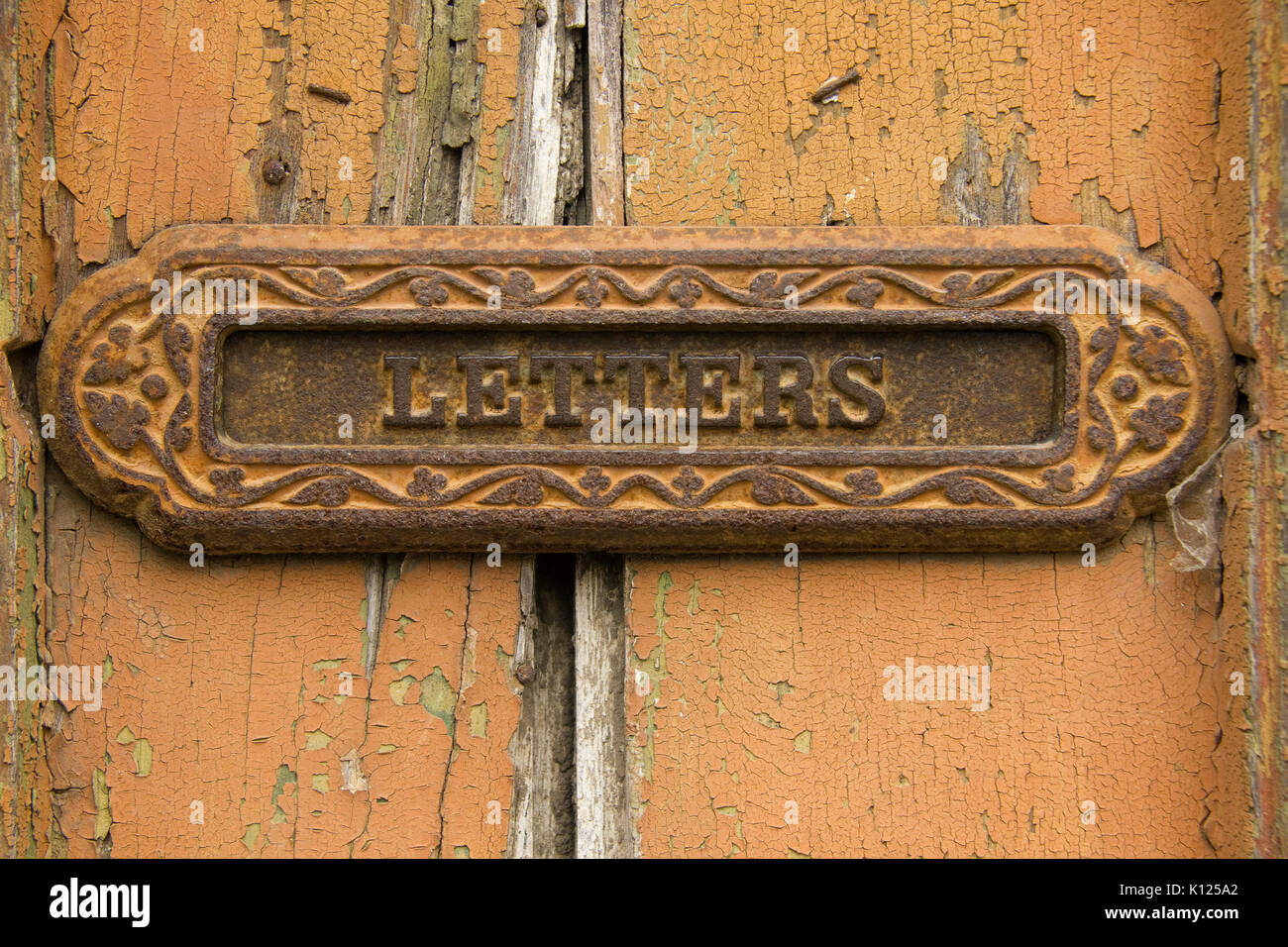 Very weathered (but beautiful) letterbox on front door Stock Photo - Alamy