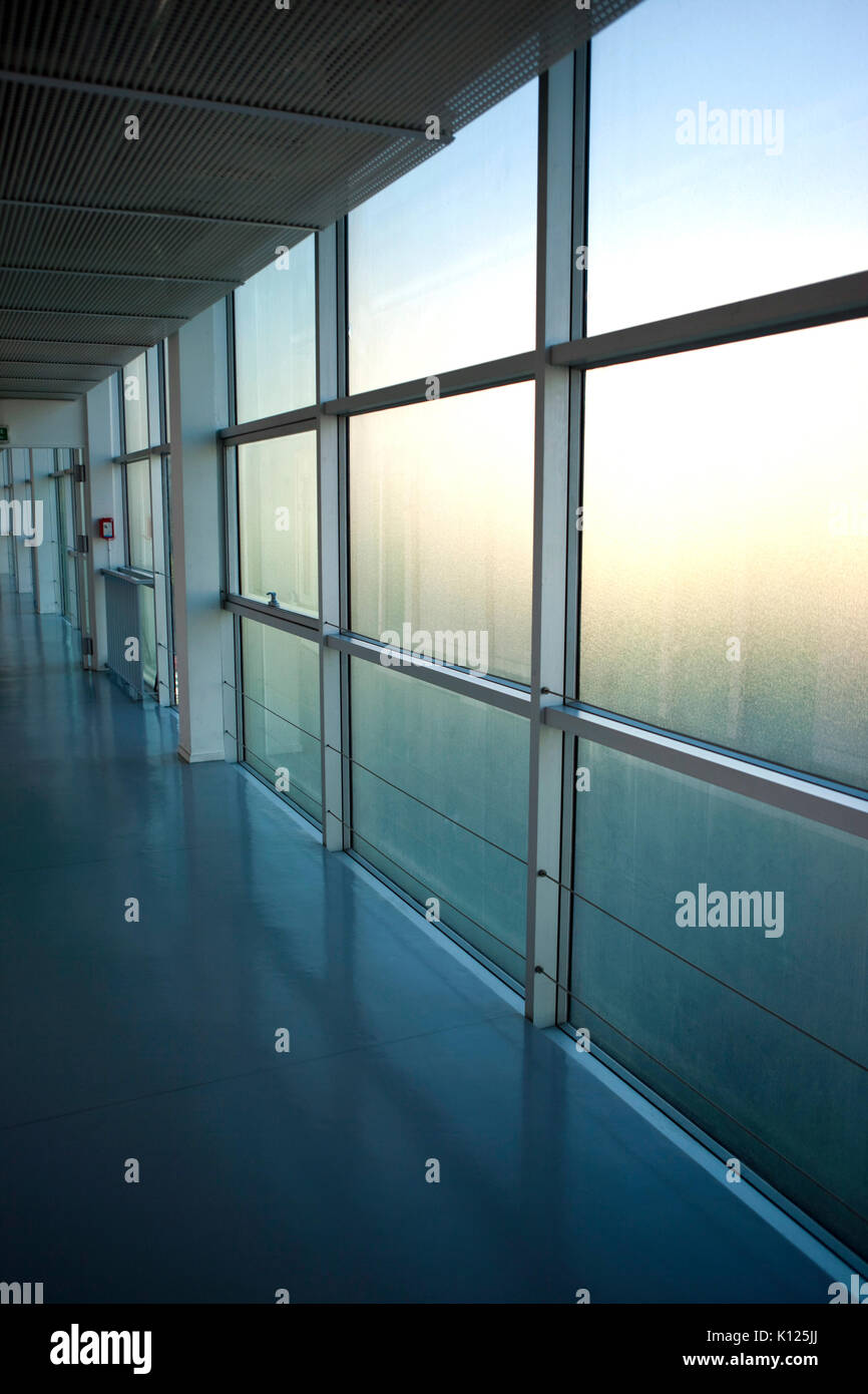 Large bay windows in the corridor of an office Stock Photo - Alamy