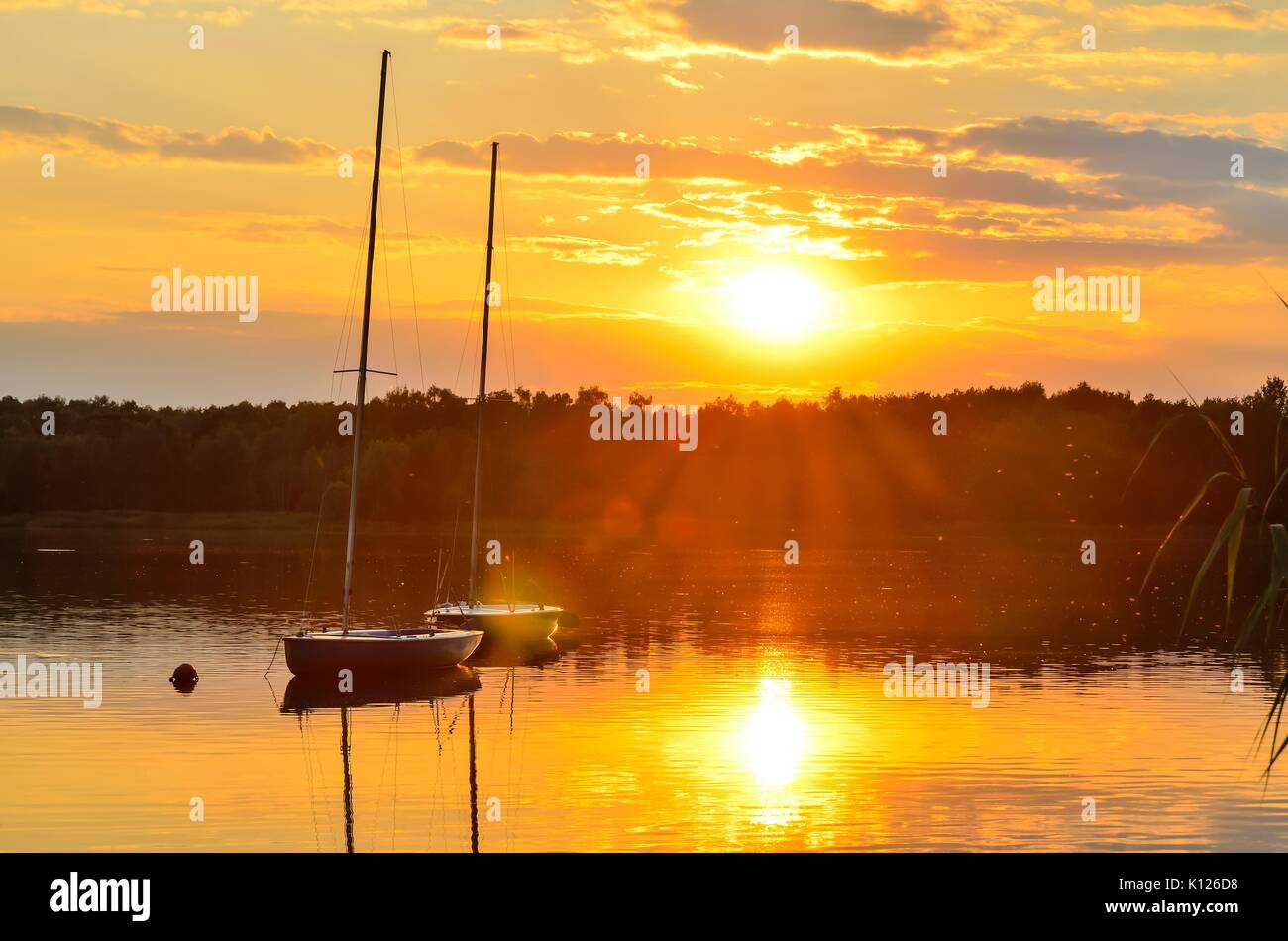 Boats on a beautiful lake. Evening summer landscape by the water Stock ...