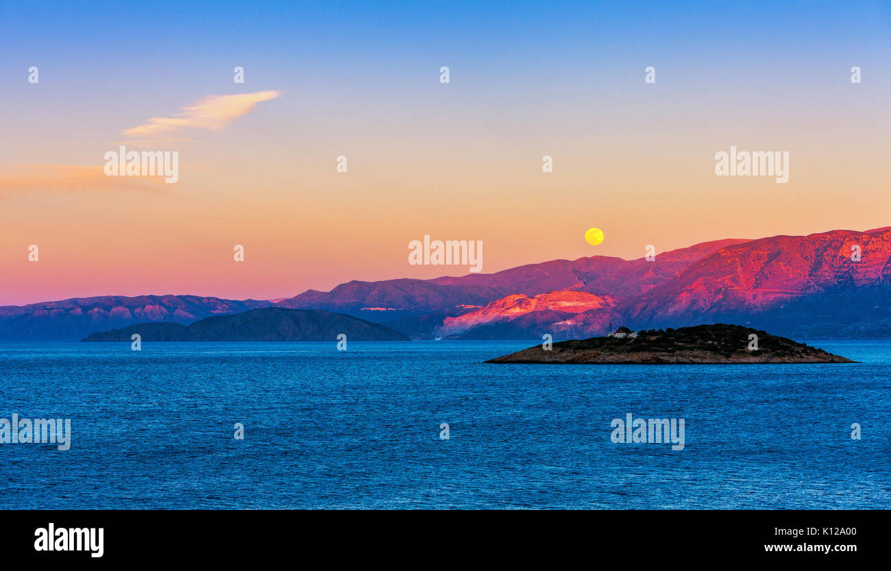 Full moon over the island of Crete at sunset, Mirabello Bay, Crete ...