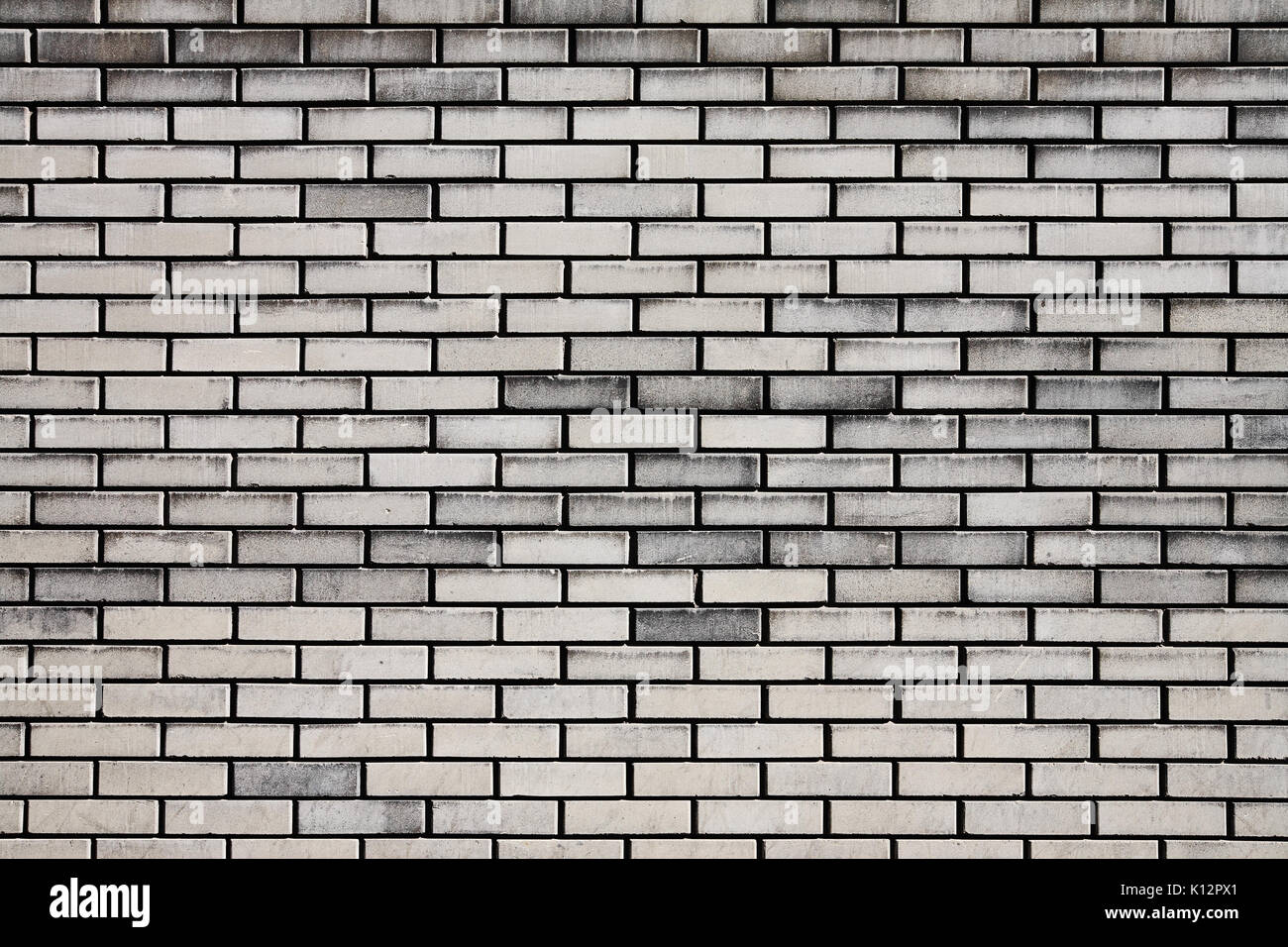Brick wall in gray, construction background Stock Photo - Alamy