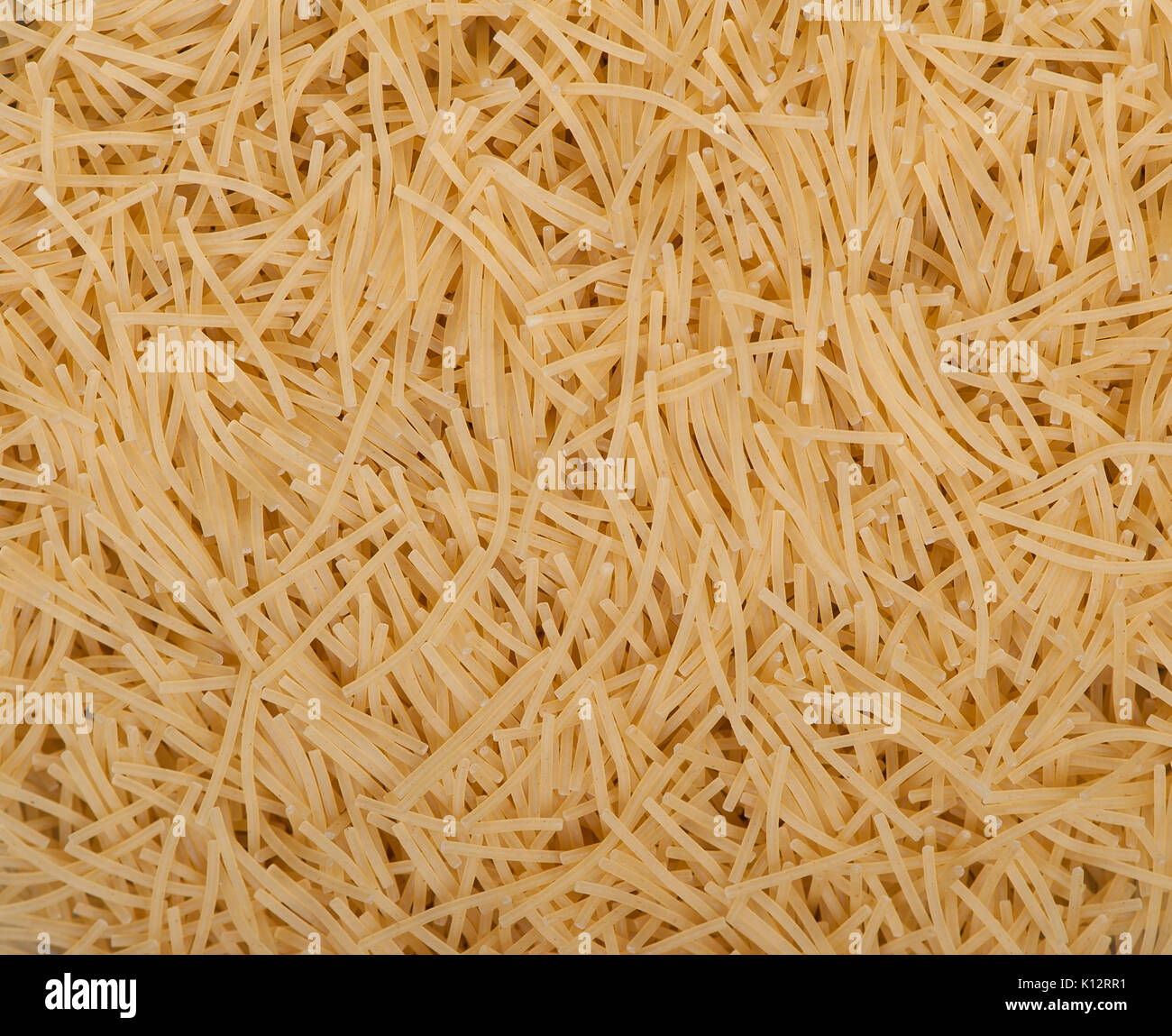 Raw vermicelli pasta texture background Stock Photo - Alamy