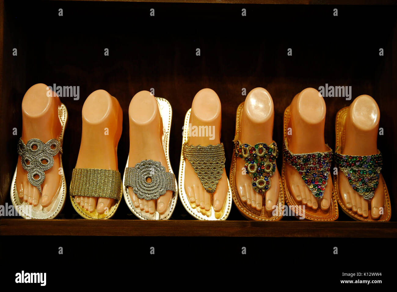 Ladies shoes are displayed on mannequin feet in the souk at Marrakech ...
