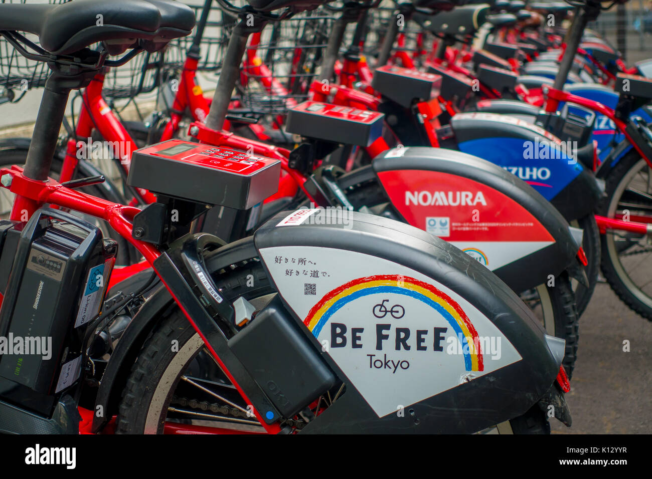TOKYO, JAPAN JUNE 28 - 2017: Shared bikes are lined up in the streets of Tokyo. Minato Bicycle ...