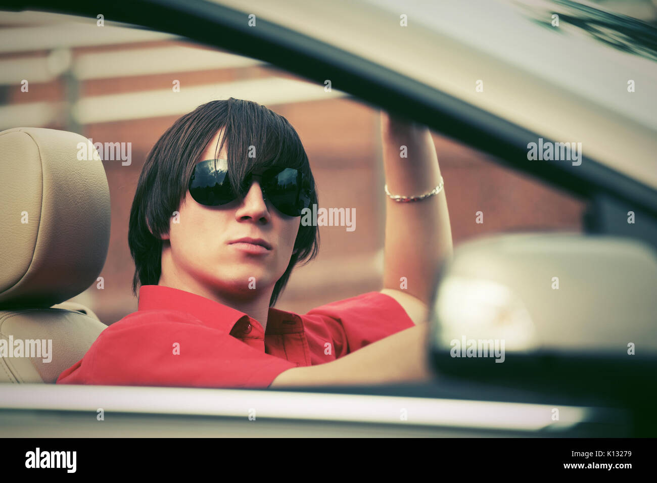 Cool guy driving convertible car hi-res stock photography and images ...