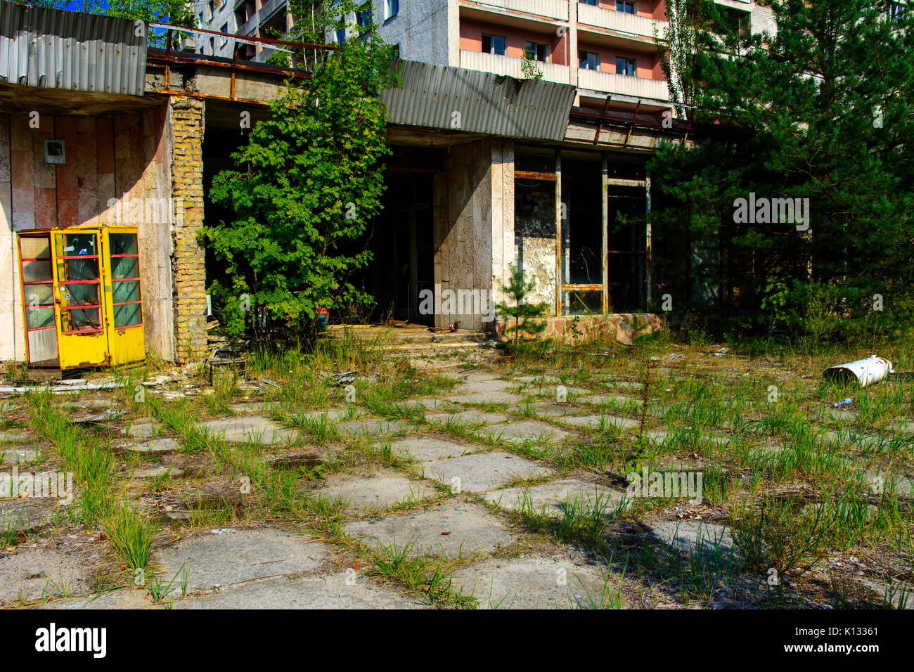 Old abandoned high-rise buildings in a dead radioactive zone. Looting ...