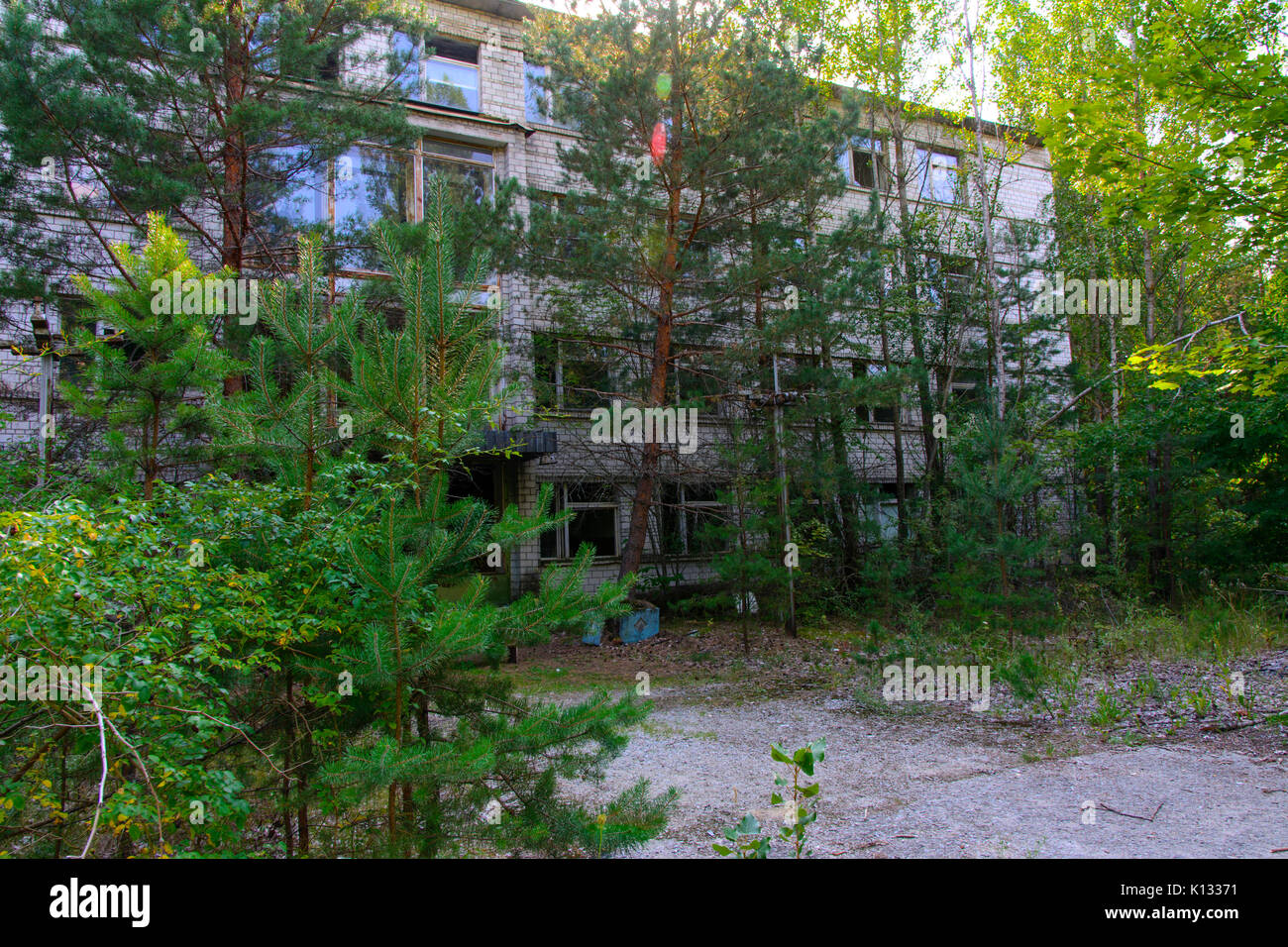 Old abandoned high-rise buildings in a dead radioactive zone. Looting ...