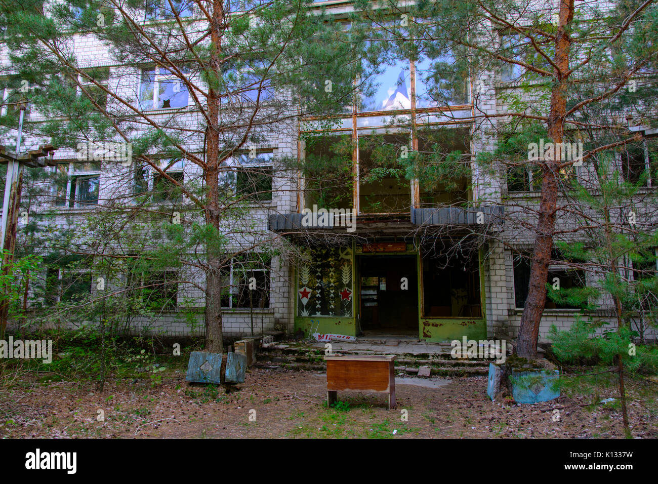 Old abandoned high-rise buildings in a dead radioactive zone. Looting ...