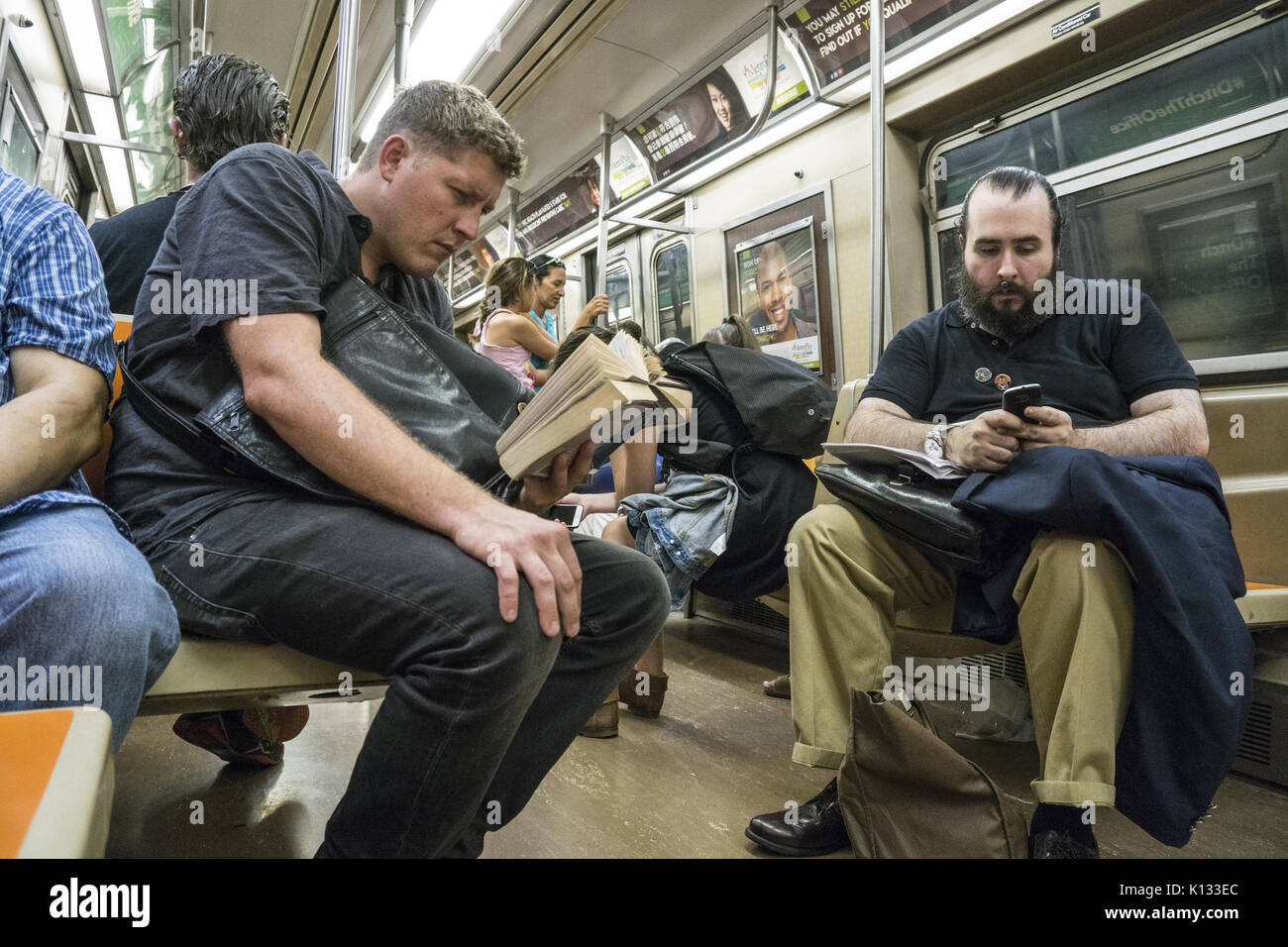People ride a New York City Subway Train in Brooklyn, New York Stock ...