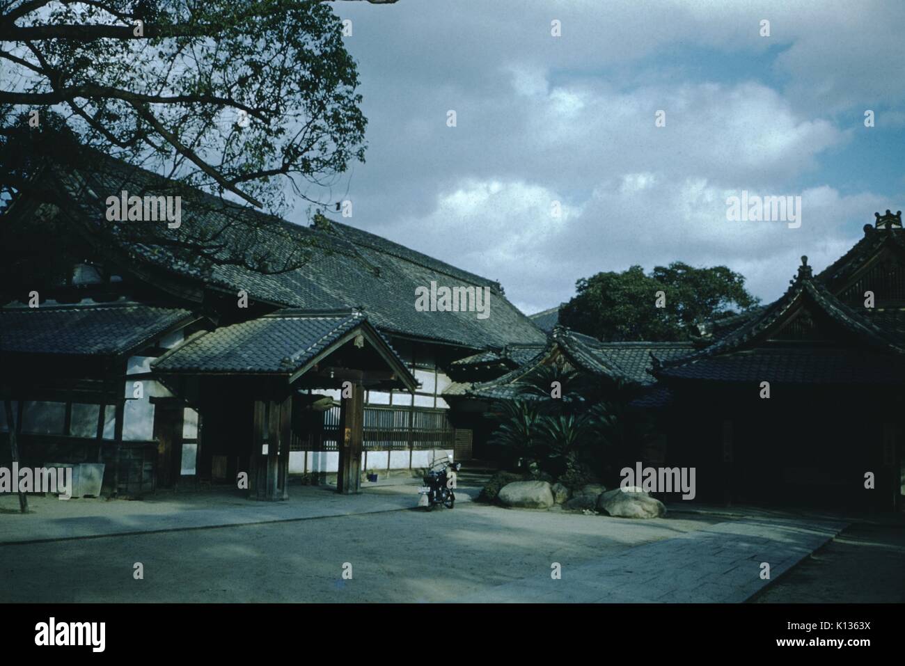 Peaceful scene in the courtyard of a temple, Japan, 1951 Stock Photo ...