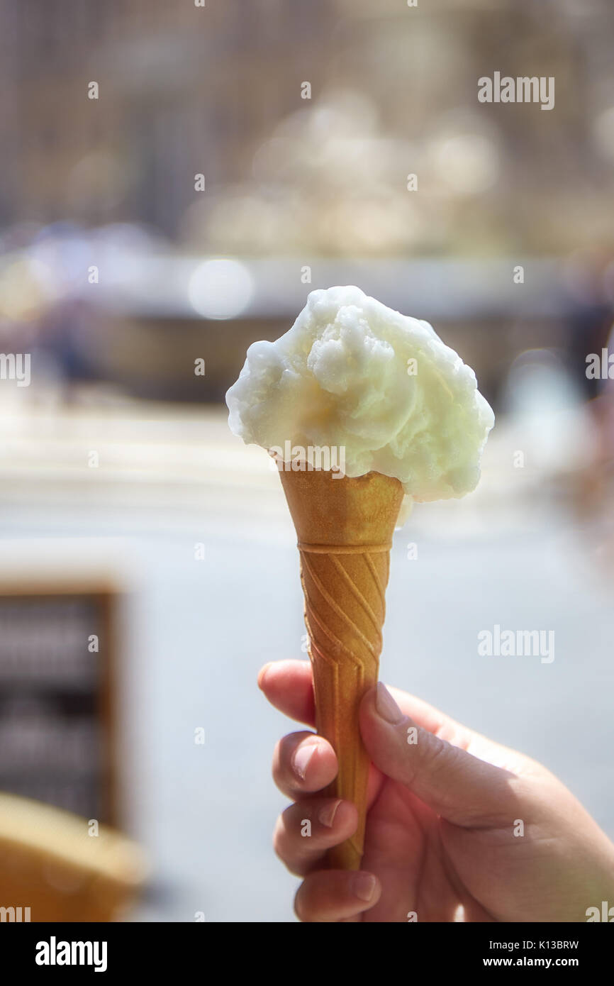 Gelato with lime taste in a woman's hand on the streets of Rome Stock ...