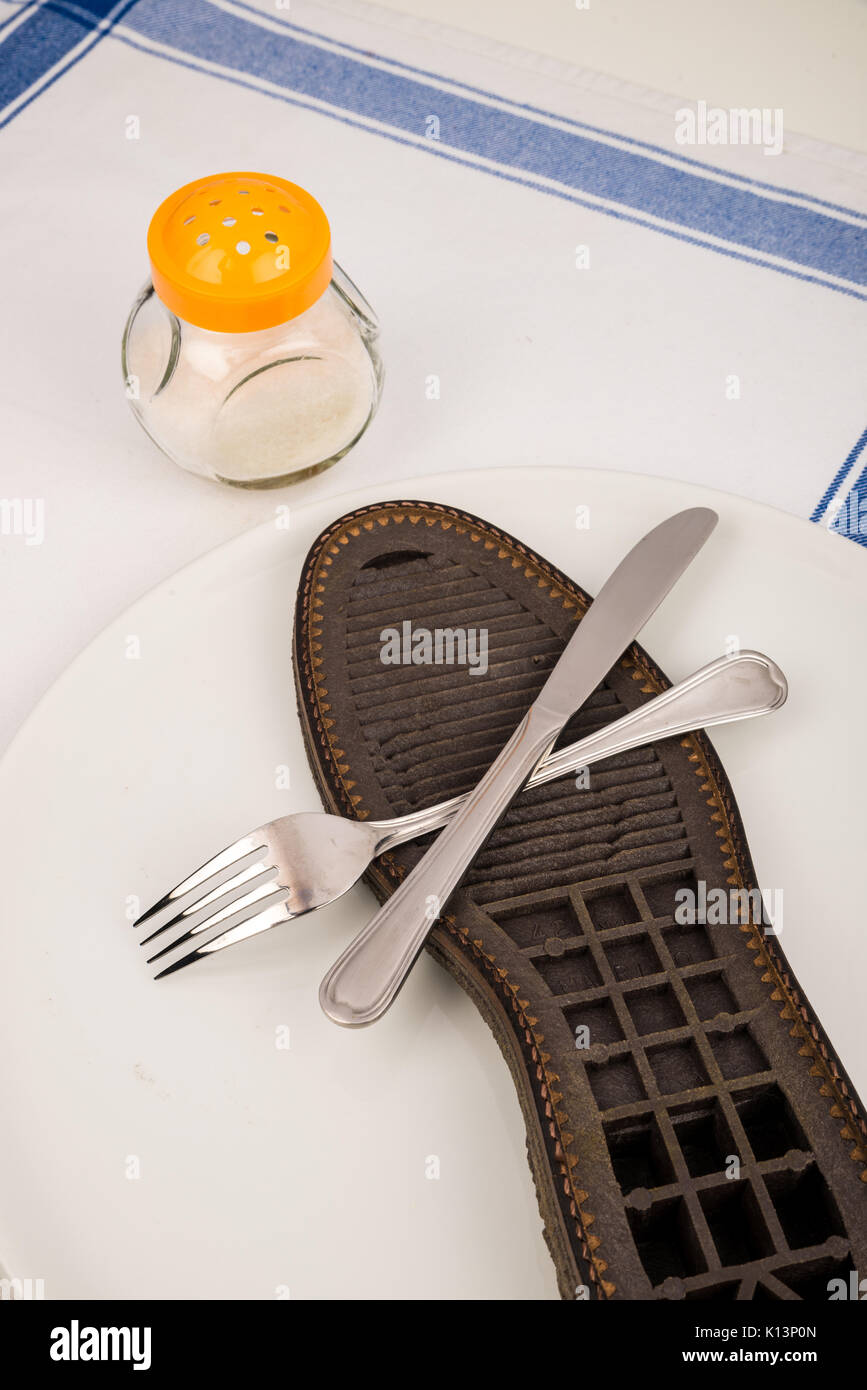 Shoe sole dished, a concept for bad cooking and tough steaks Stock ...