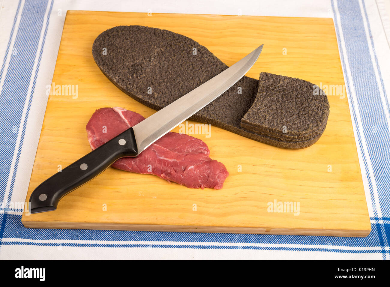 Beef steak next to a shoe sole, a poor quality meat concept Stock Photo ...