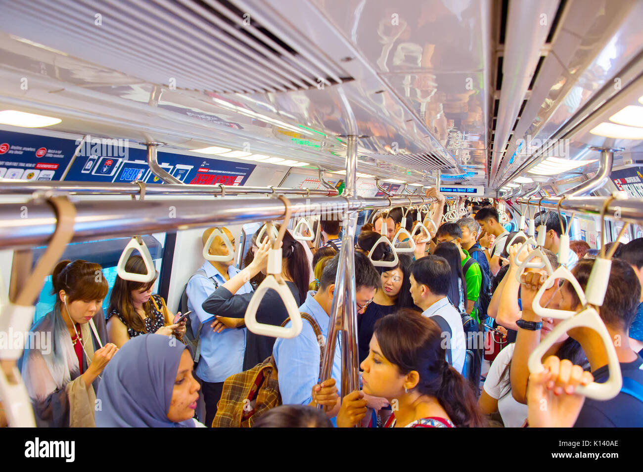SINGAPORE - JAN 13, 2017: Passengers in Singapore Mass Rapid Transit ...