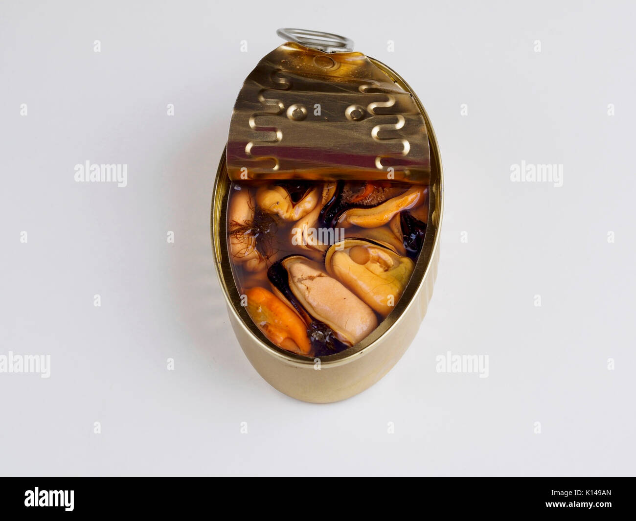 Natural mussels canned on white background Stock Photo - Alamy