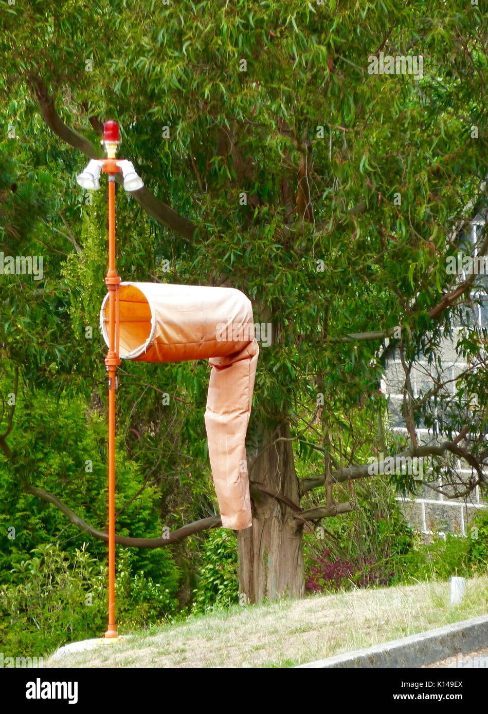 Deflated windsock sign no wind Stock Photo - Alamy