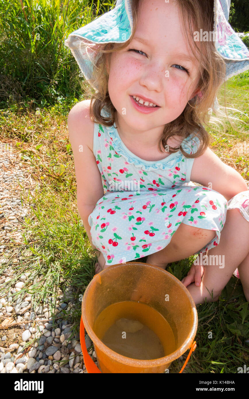 Half English, half French child / kid / kids aged 5, with a bucket and ...