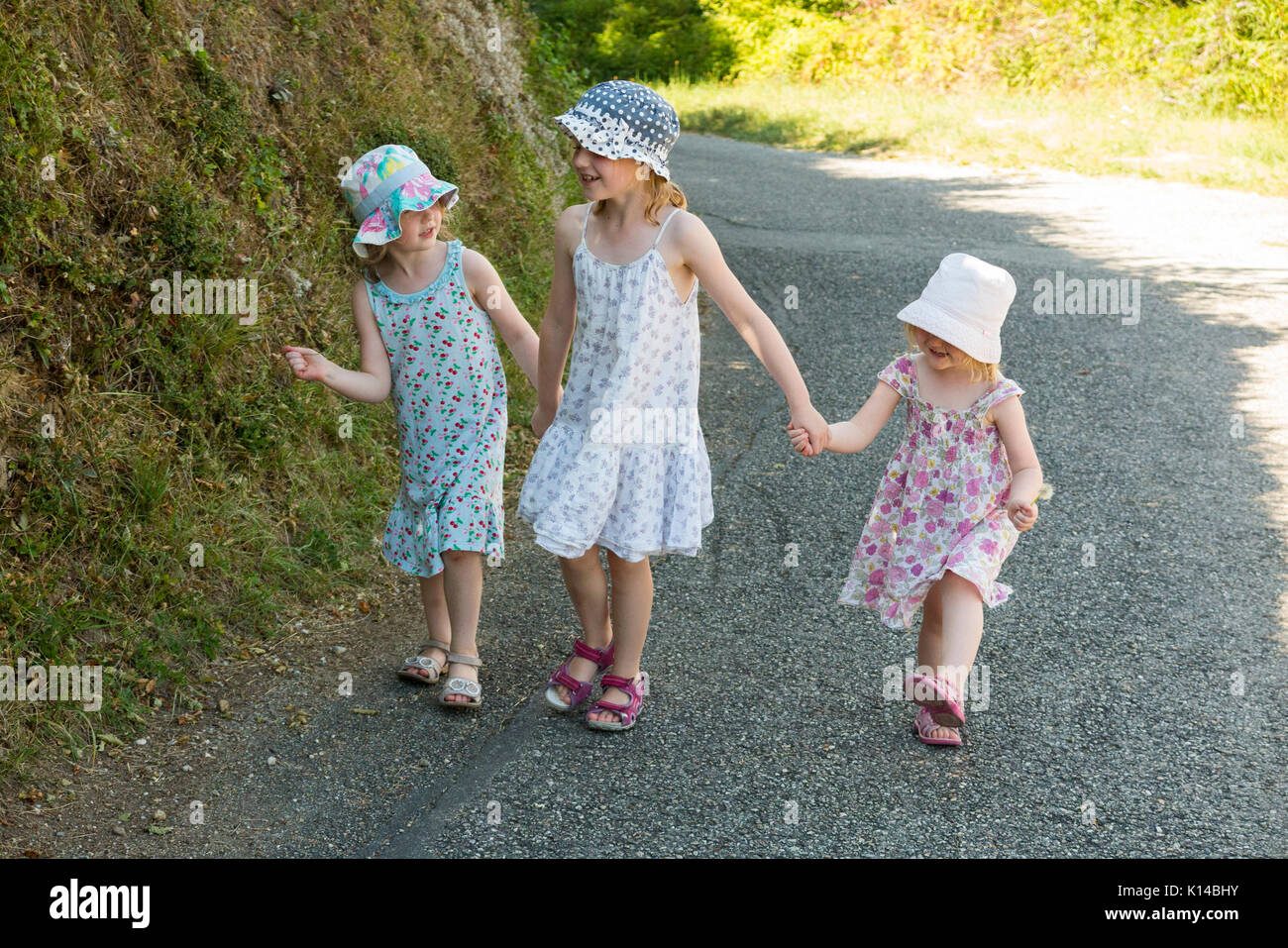 Three Sisters Holding Hands