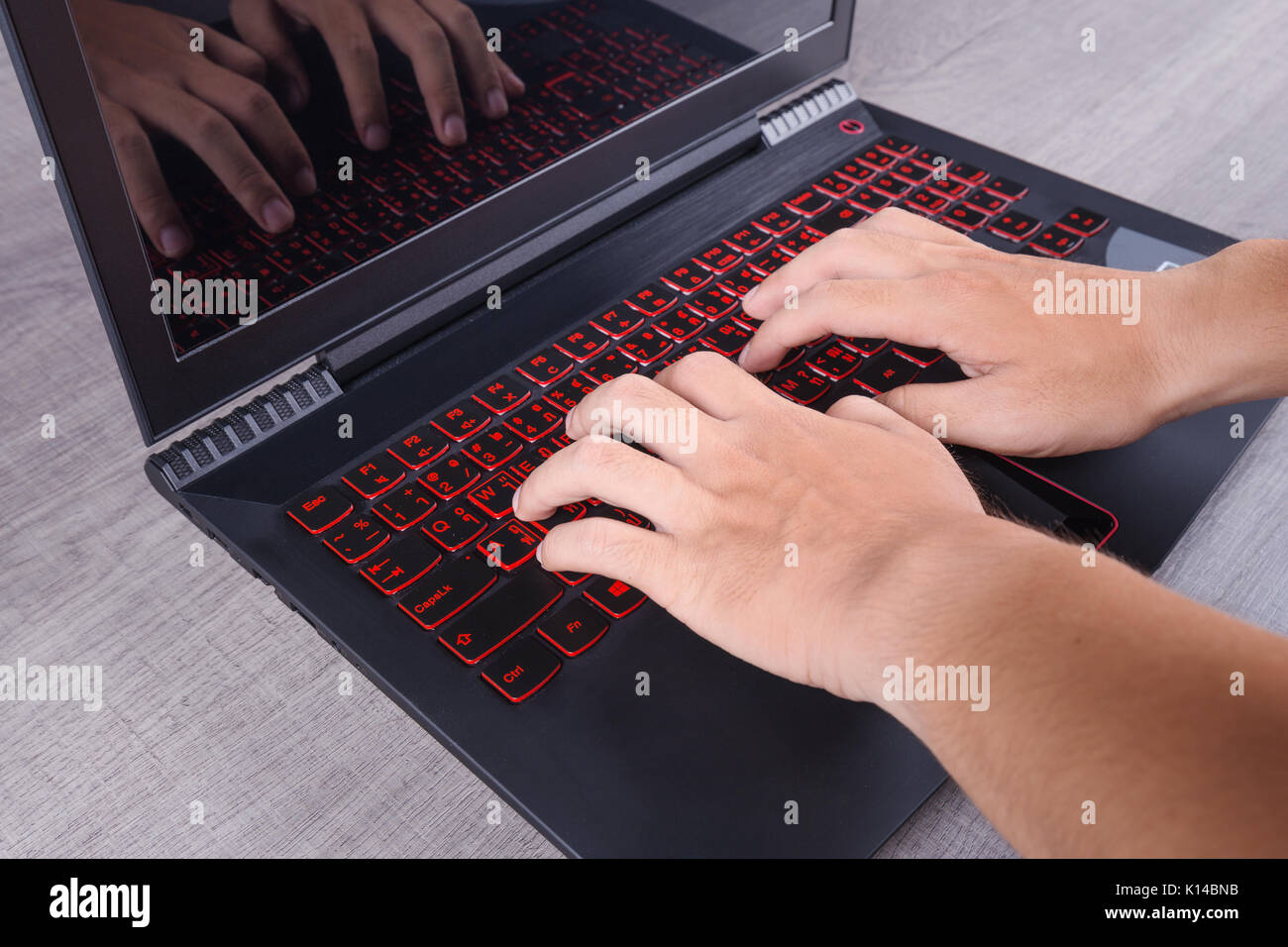 business hand typing keyboard of laptop on wood background Stock Photo ...