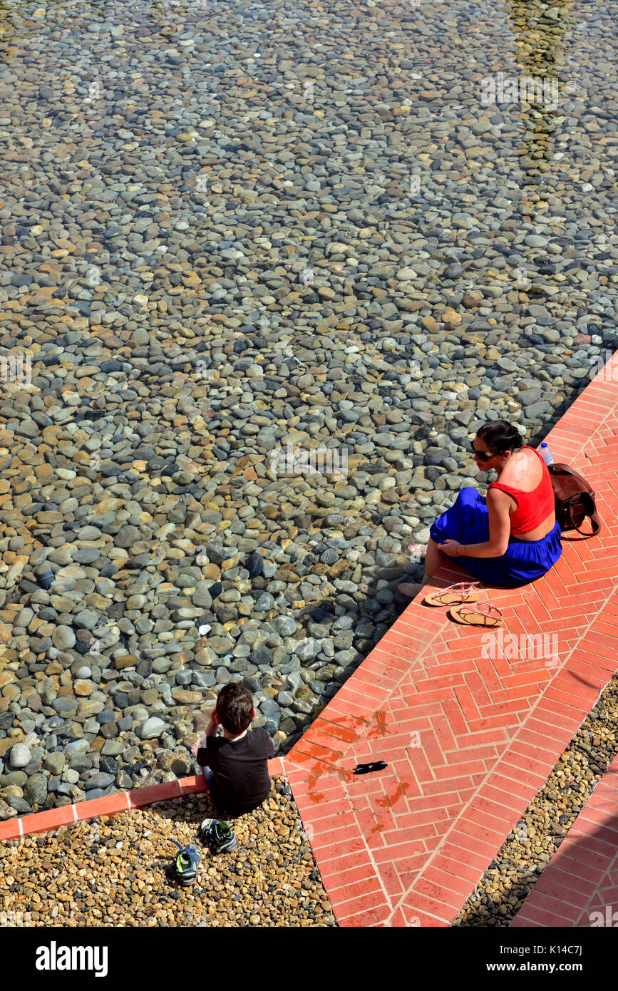 Abstract two people, pebbles, brick walkway Stock Photo - Alamy