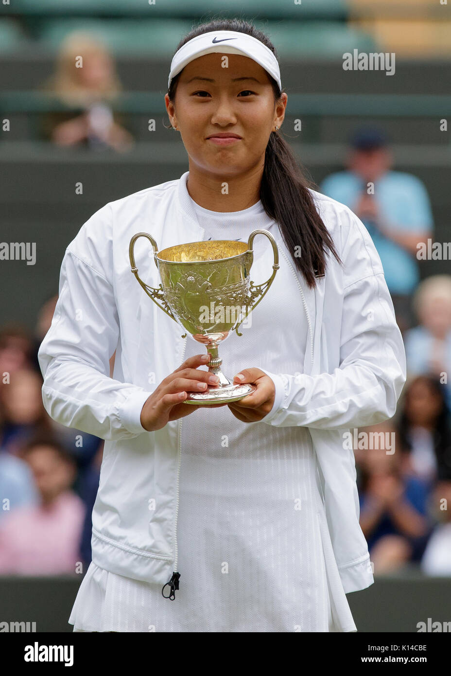 Claire Liu of the USA celebrates with the trophy at the Girls Singles ...