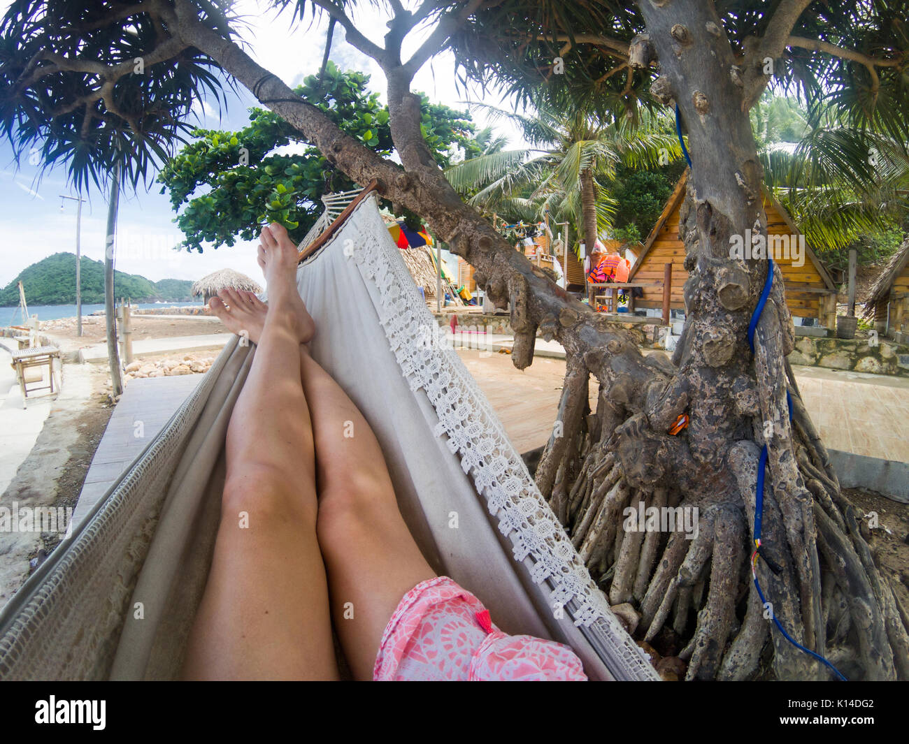 Woman legs relaxing on hammock hi-res stock photography and images - Alamy