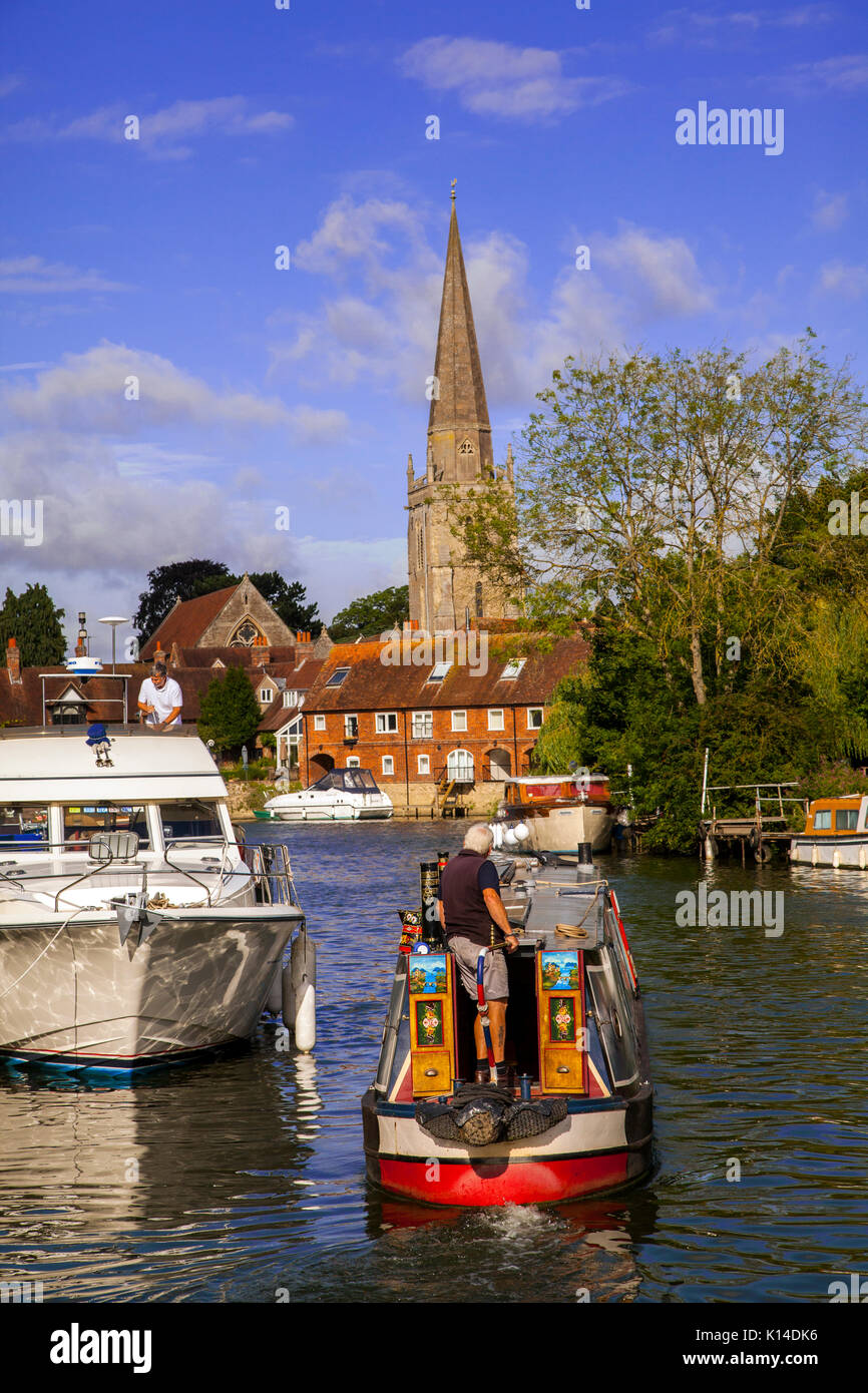 Narrowboat owner leaving his overnight mooring on the river Thames at ...