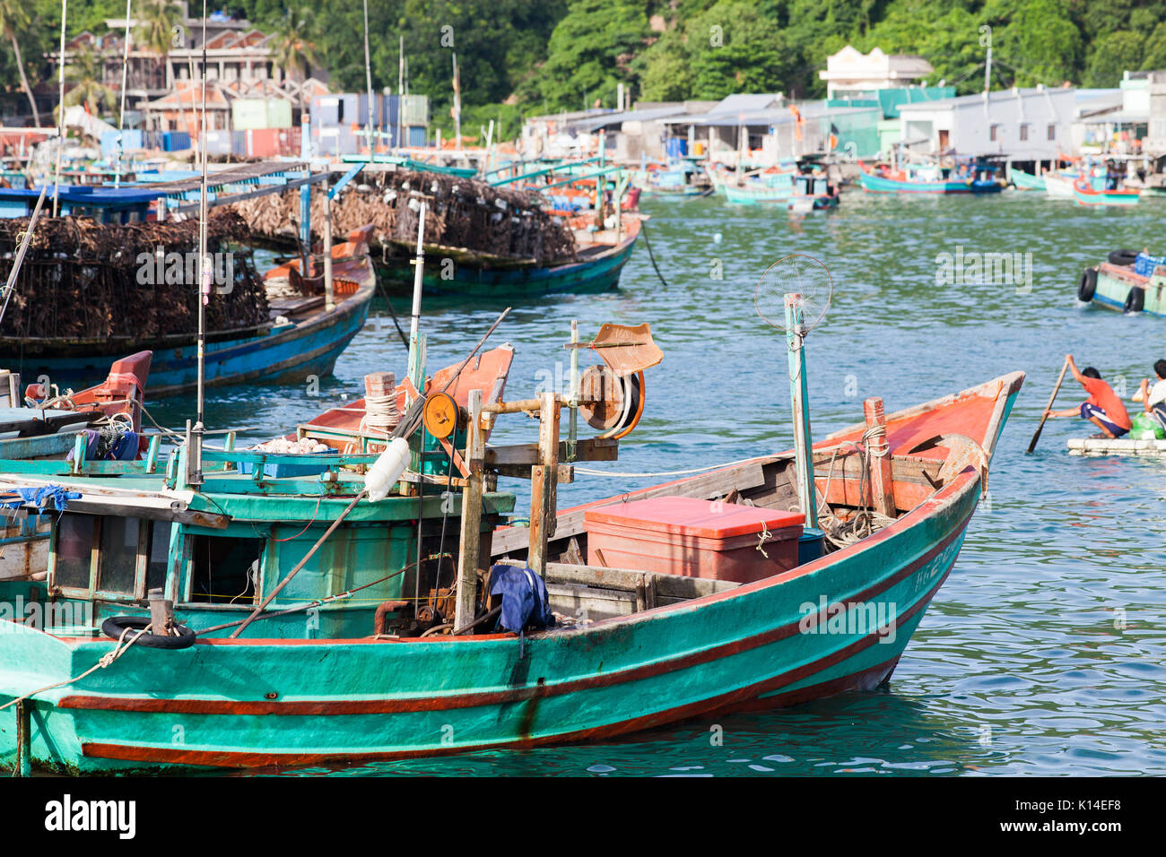 traditional colorful Vietnamese fishing boats in Ben Ngu wharf of Nam ...