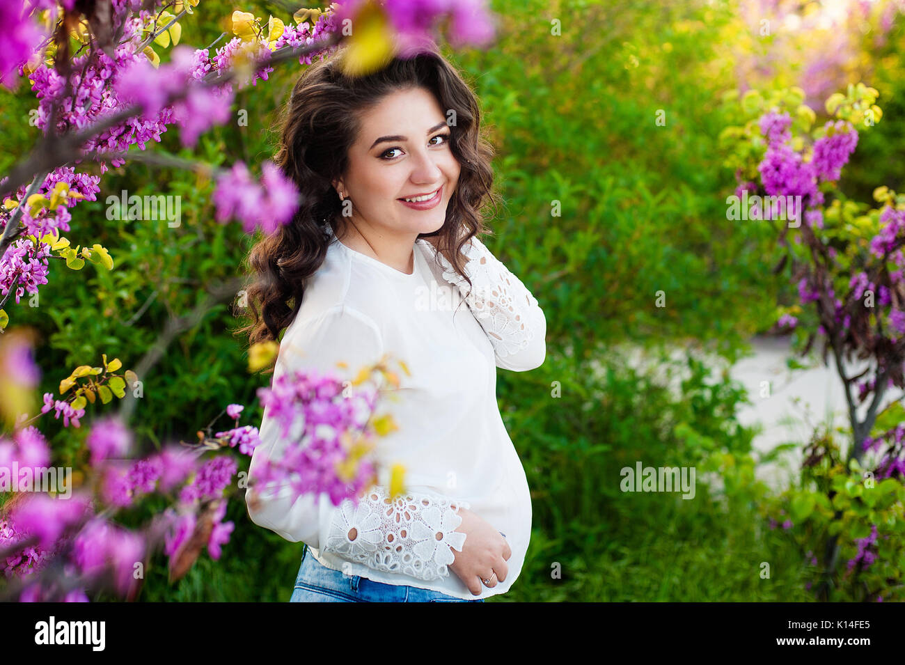 Family walking hand in hand on grass hi-res stock photography and ...
