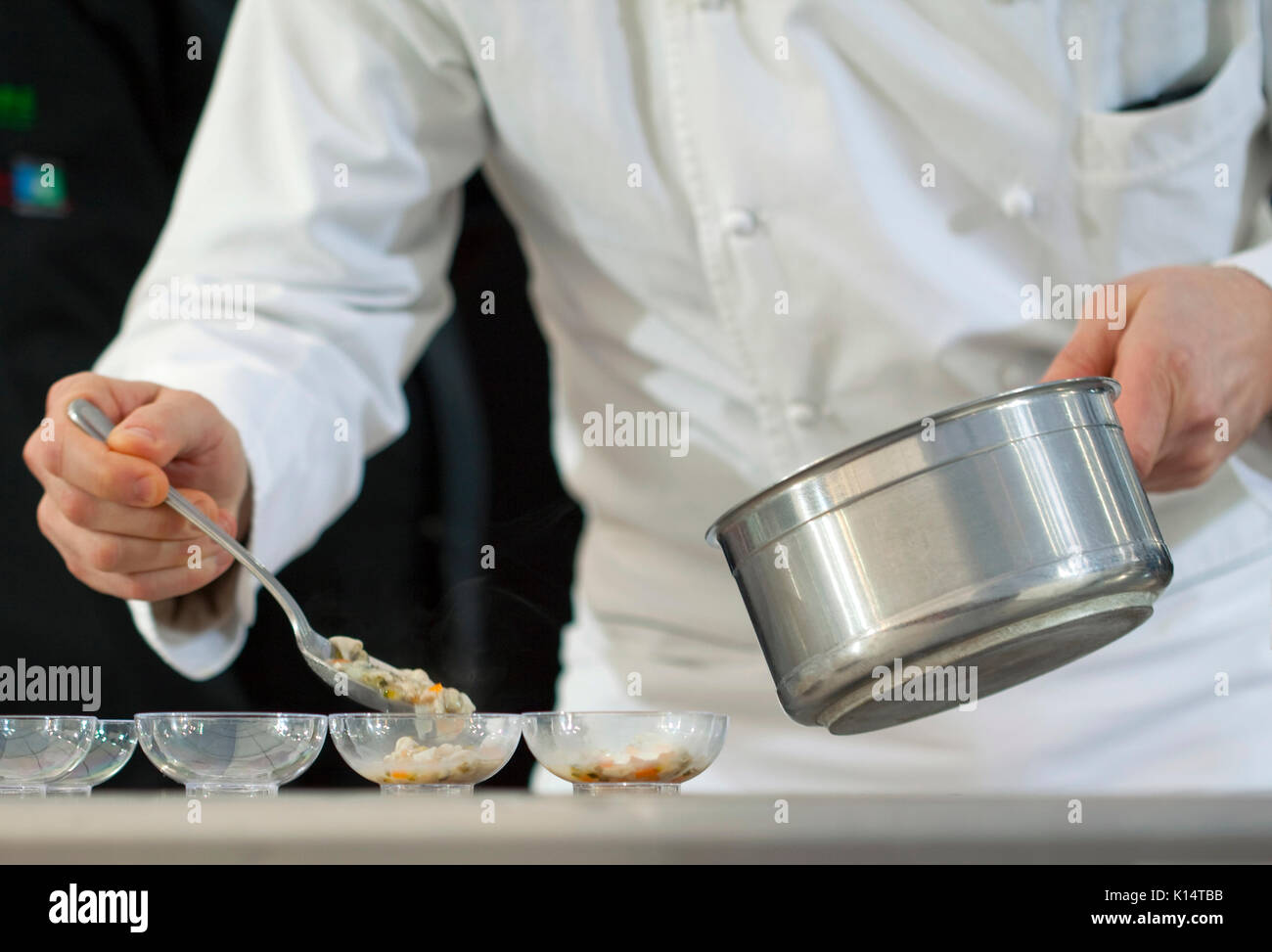 Chef cooking in cups in a restaurant kitchen Stock Photo - Alamy