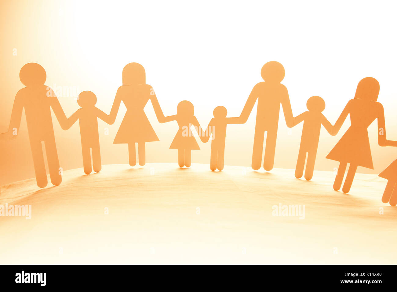 Family paper chain cutout holding hands Stock Photo - Alamy