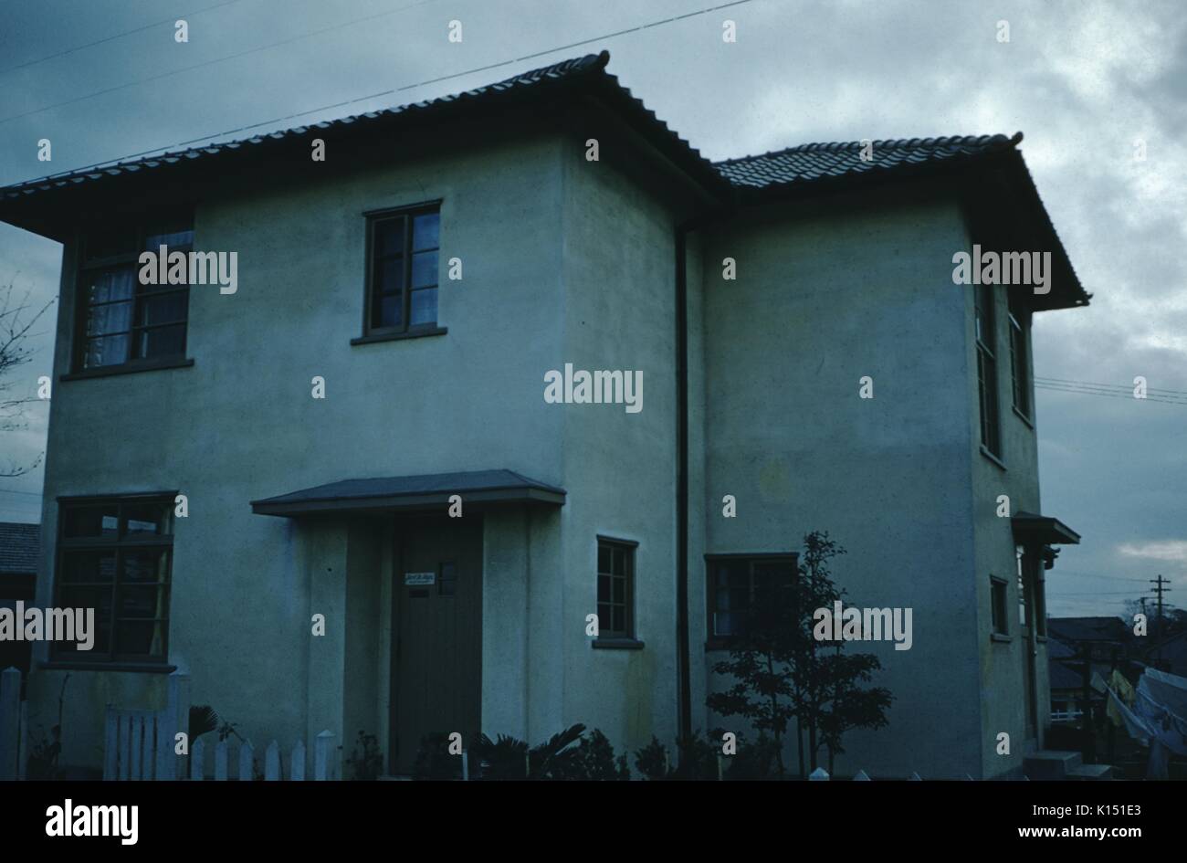 Two story home on an overcast day, Japan, 1952 Stock Photo - Alamy