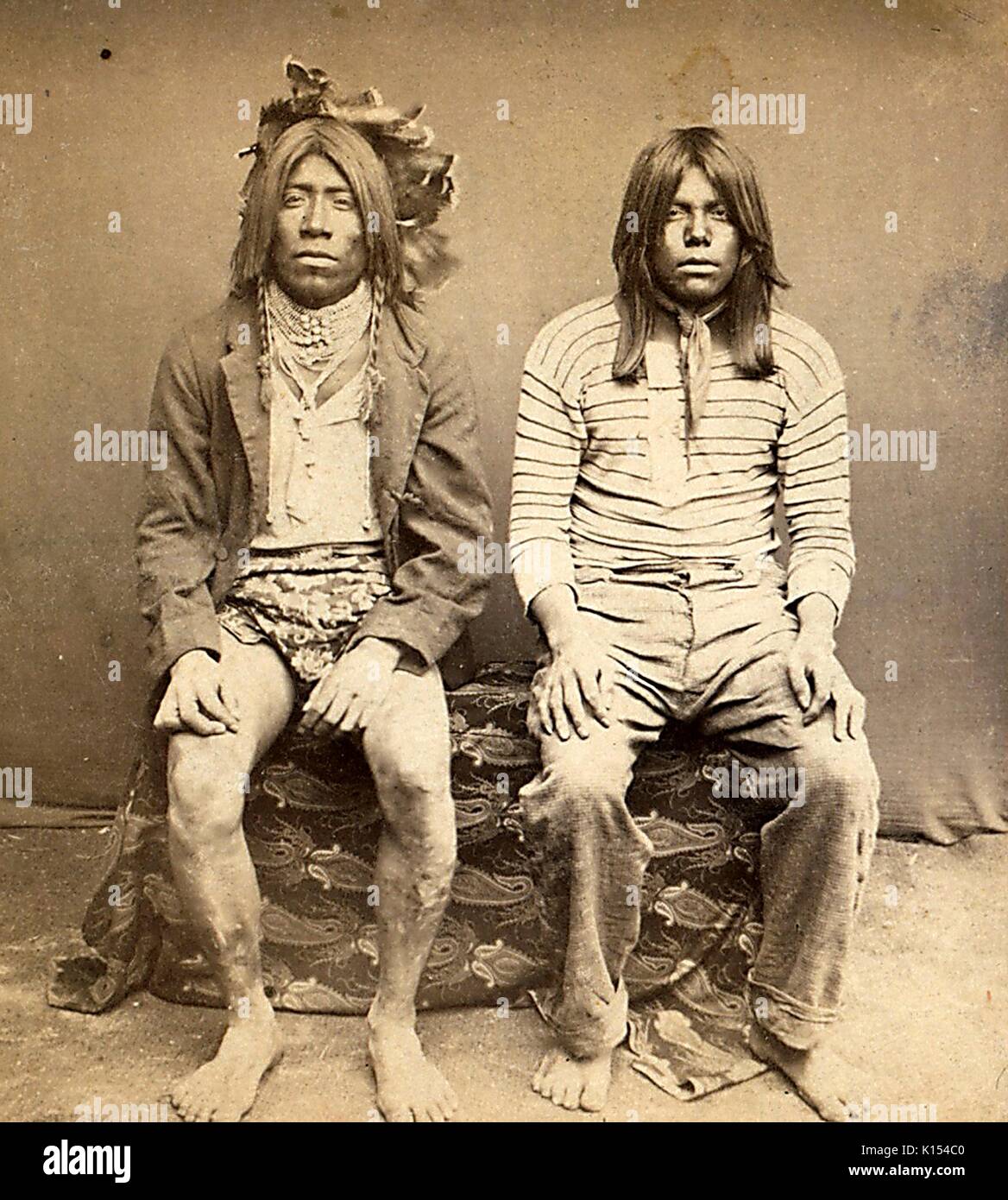 Portrait of two Yuma men in Western clothing, both sitting, one wearing ...